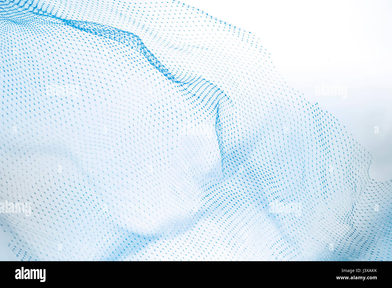 Closeup of fishnet on white background. Blue tone Stock Photo - Alamy