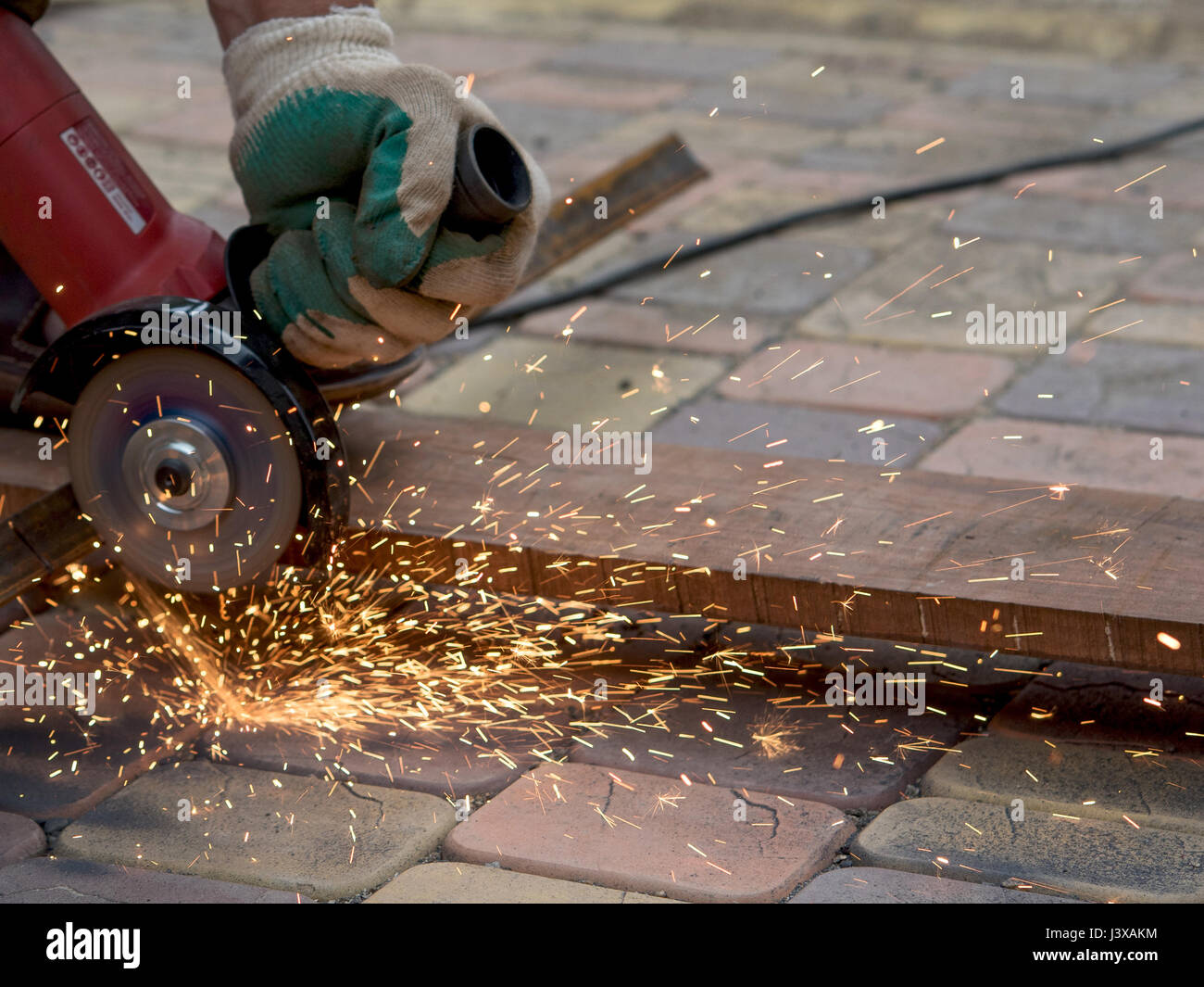 man cuts metal abrasive disk Stock Photo - Alamy