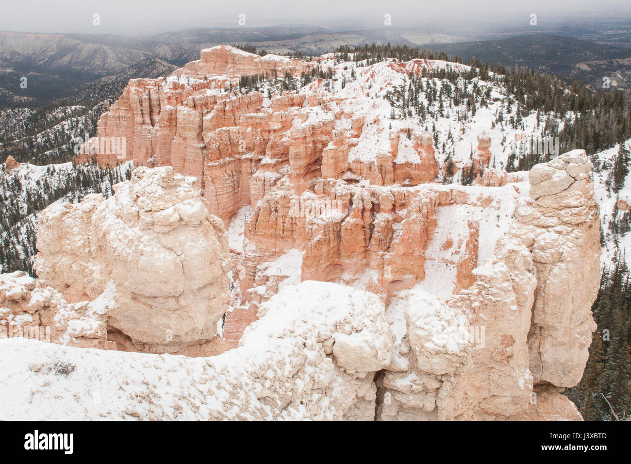 Snow-coverd hoodoos (irregularly-shaped earthen spires) in winter at ...