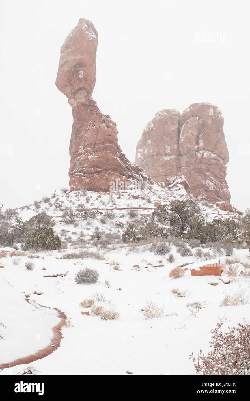 Balanced Rock formation covered in snow. Arches National Park, Utah ...