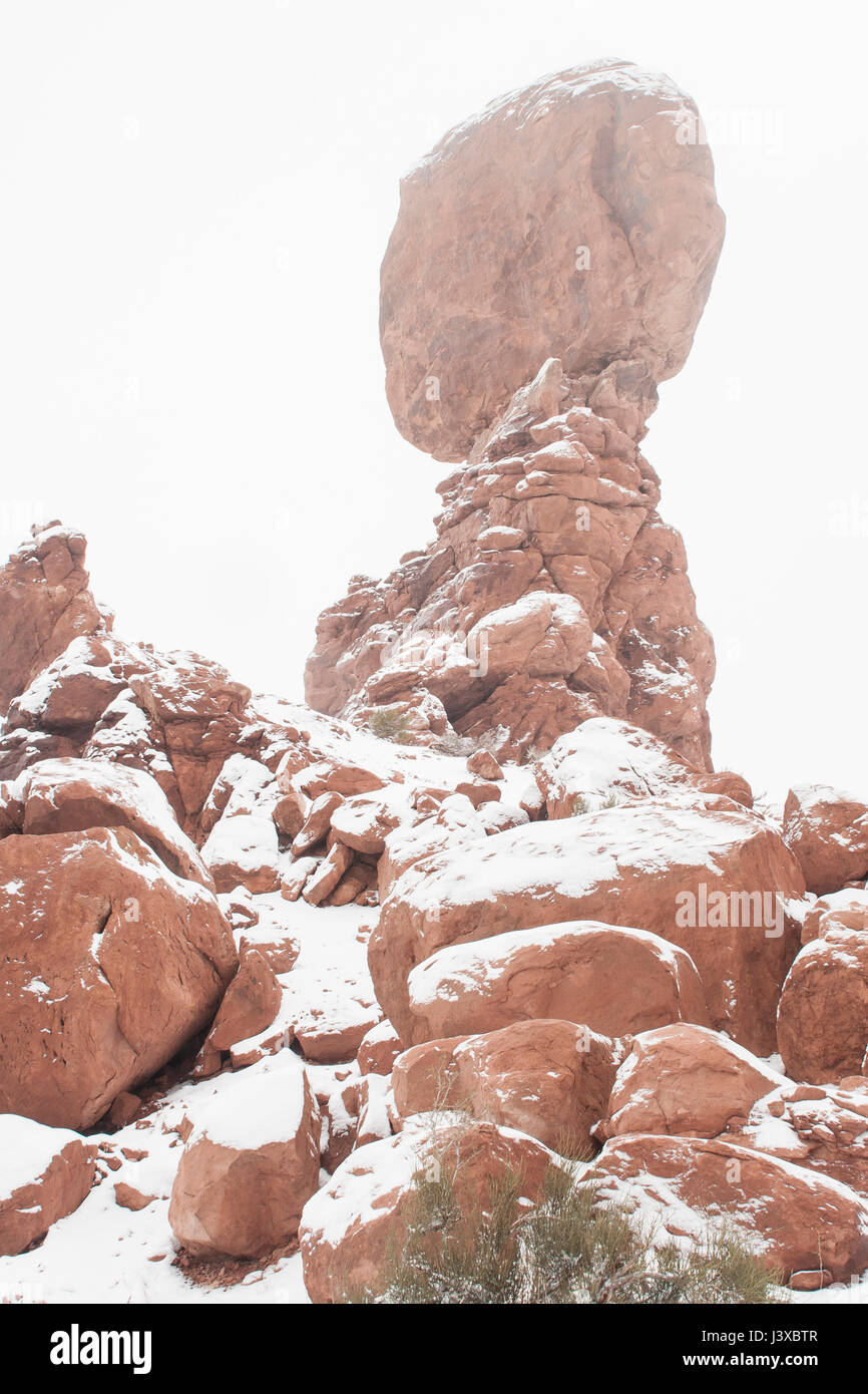 Balanced Rock formation covered in snow. Arches National Park, Utah ...