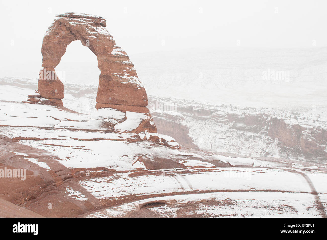 Delicate Arch rock formation covered in snow. Arches National Park ...