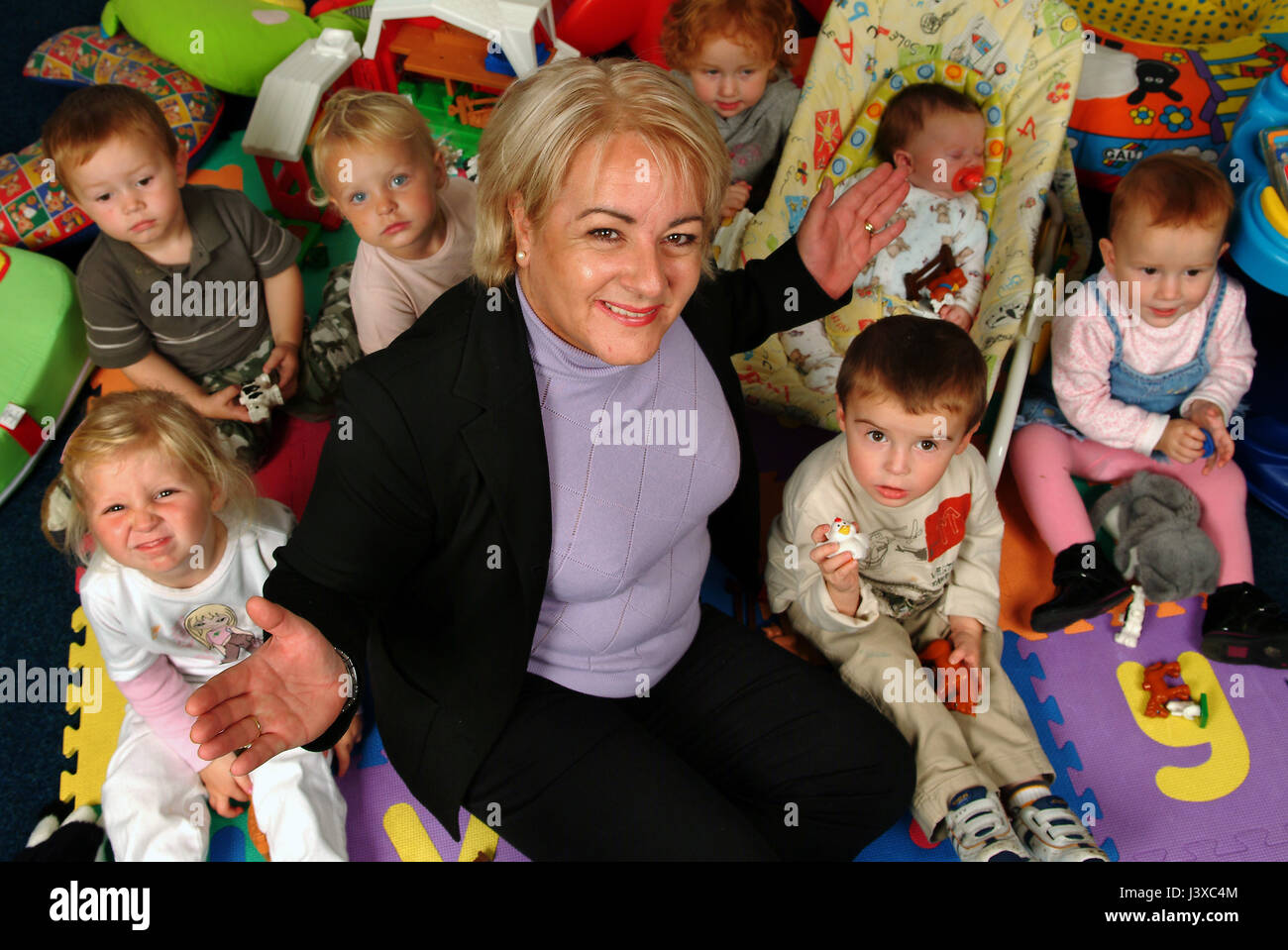 Child minding hi-res stock photography and images - Alamy