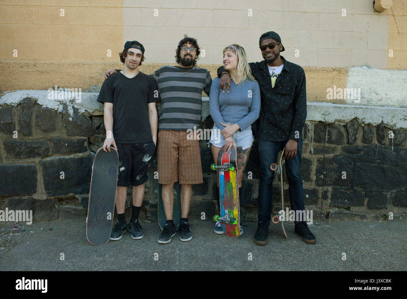 Four young adults Stock Photo - Alamy