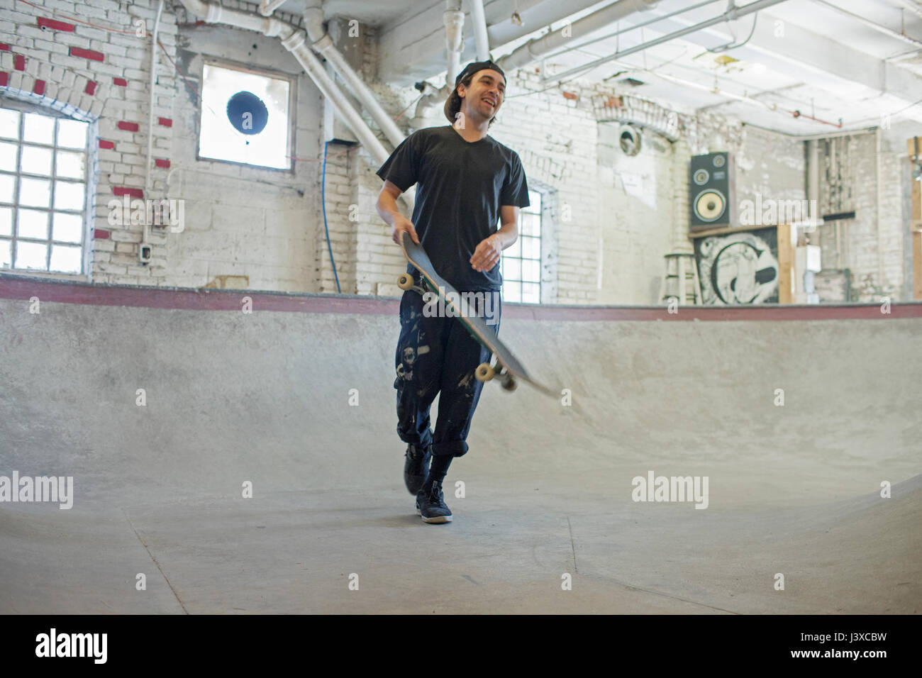 Young man skateboarding Stock Photo - Alamy