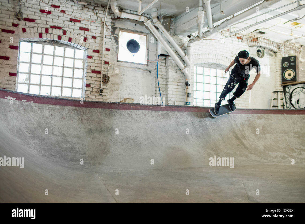 Young man skateboarding Stock Photo - Alamy