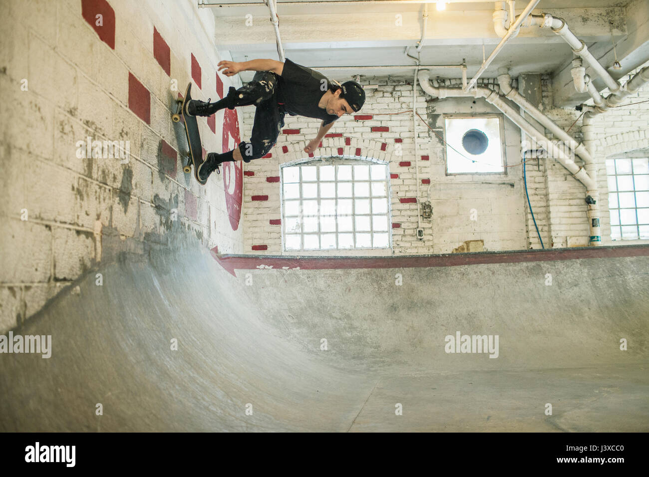 Young man skateboarding Stock Photo - Alamy