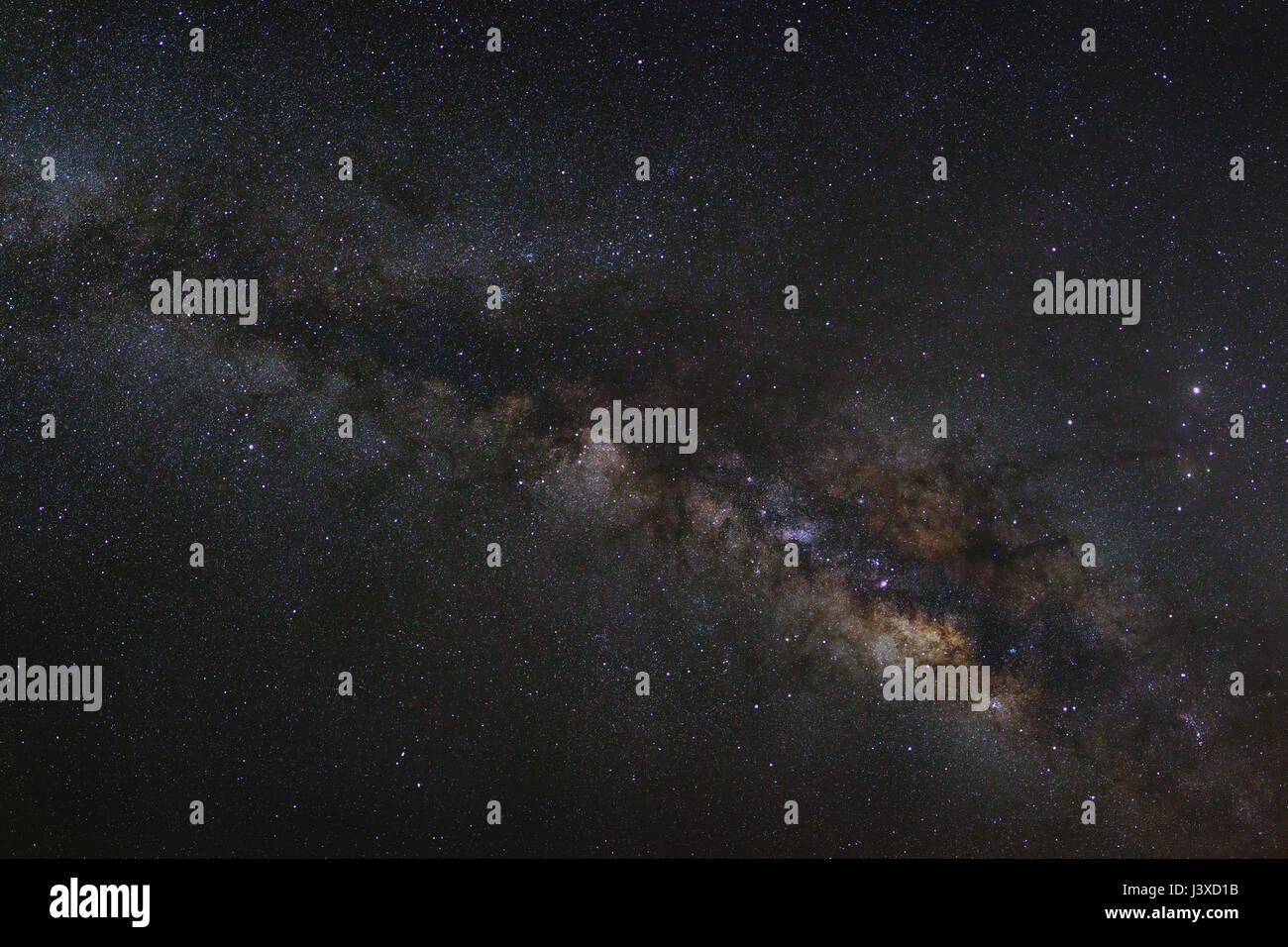 milky way galaxy on a night sky, long exposure photograph, with grain ...