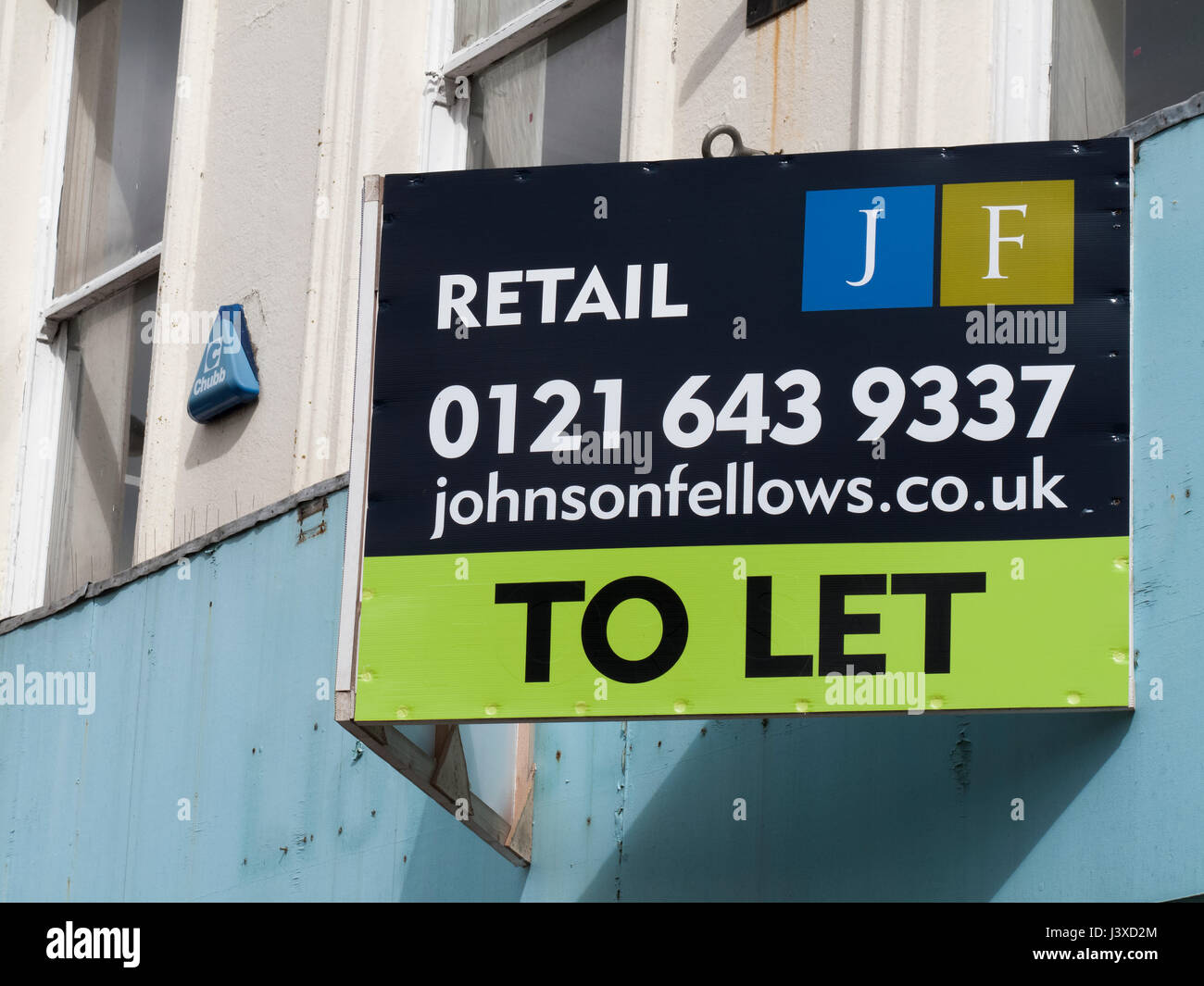 Commercial vacant shop to let sign over retail unit Stock Photo - Alamy