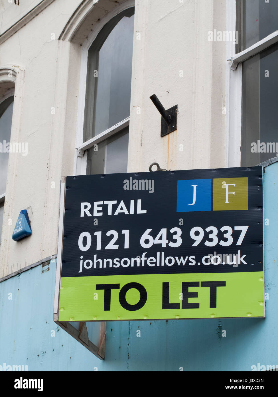 Commercial vacant shop to let sign over retail unit Stock Photo - Alamy
