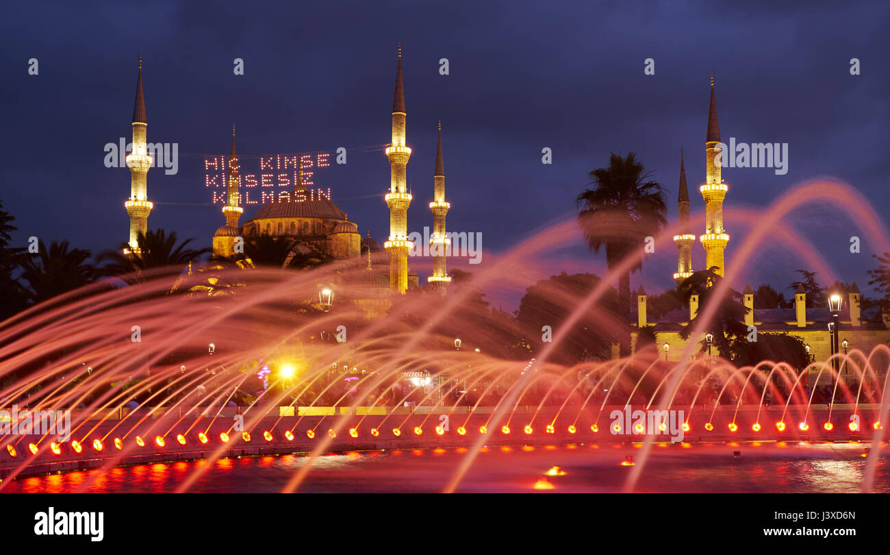 The view of Blue mosque throught the fountain water in the evening ...