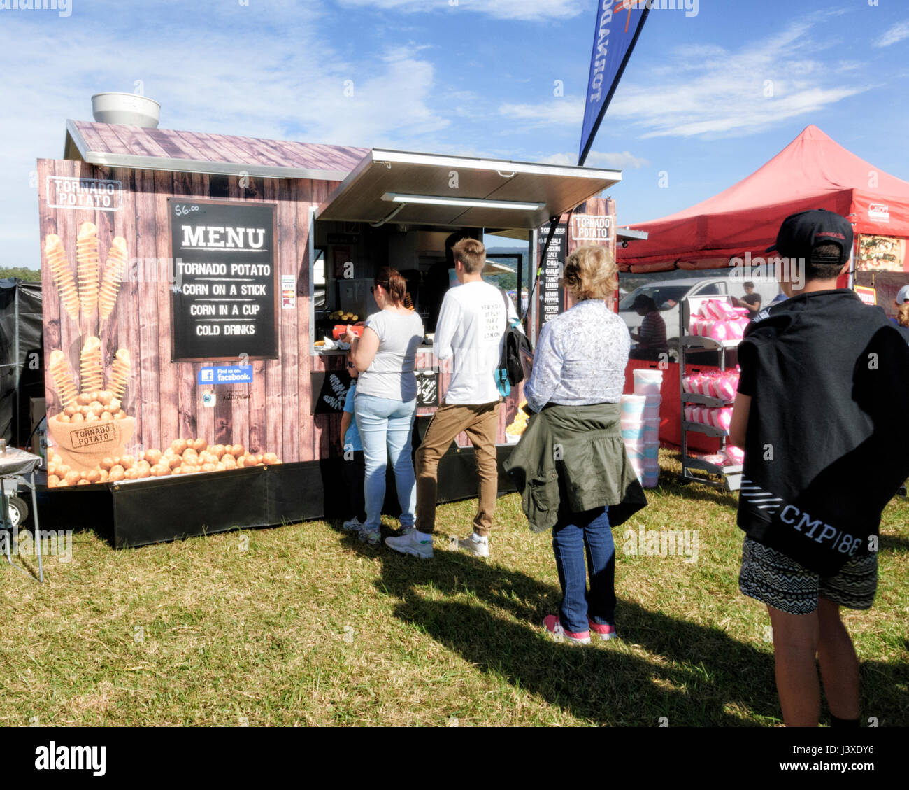 People queueing up at a Tornado Potato food stall at the Wings over ...