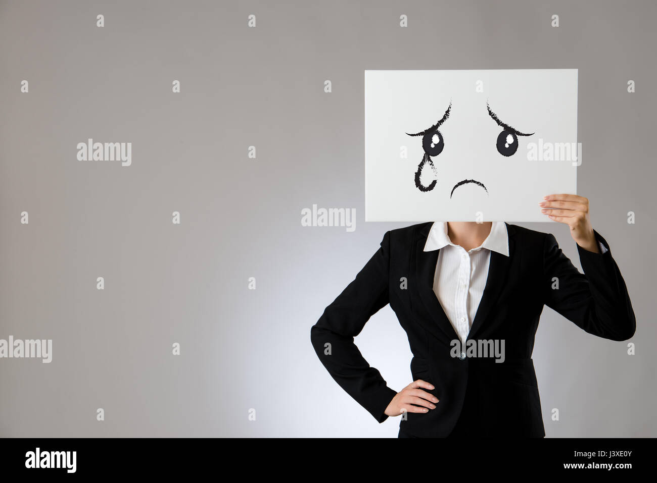 business boss holding blank white board with sad and crying face ...