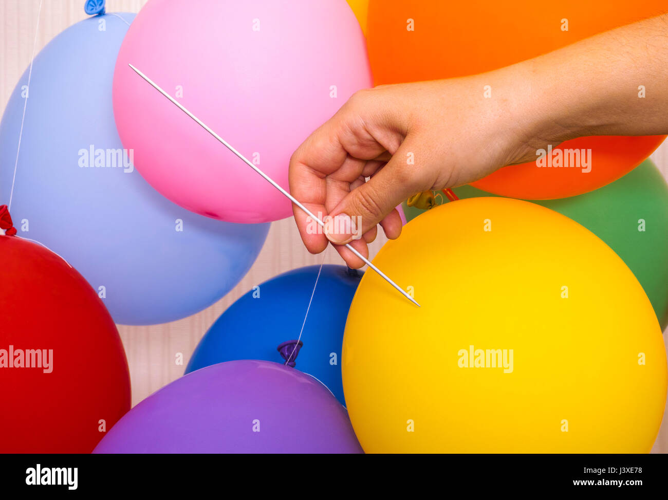 Woman balloon pop hi-res stock photography and images - Alamy
