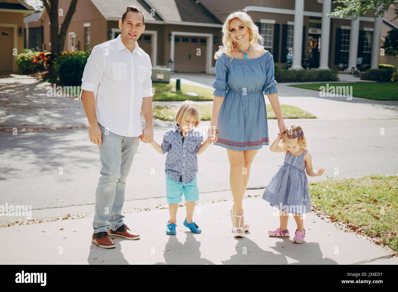 young family on the street Stock Photo - Alamy