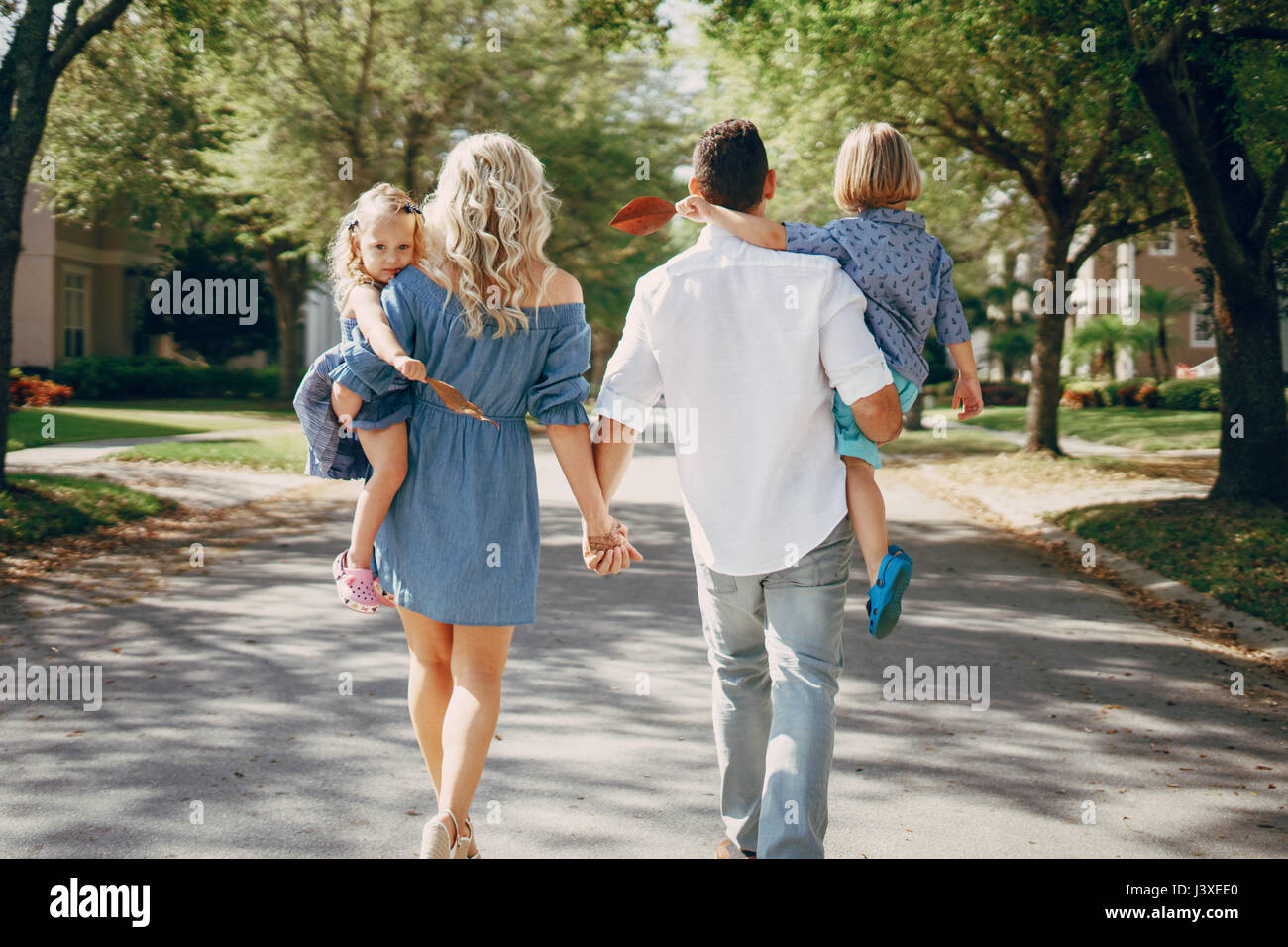 young family on the street Stock Photo - Alamy