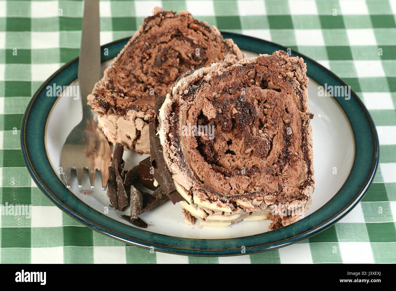 two slices of triple chocolate roulade with plate and fork Stock Photo ...