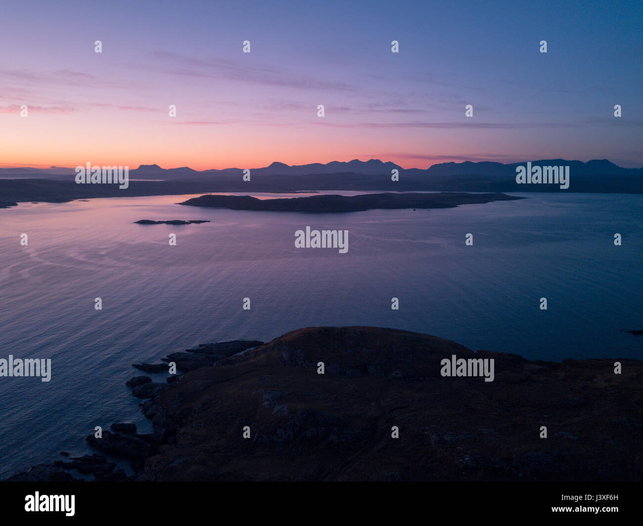 Aerial view of sunrise over the Scottish Highlands near Poolewe looking ...