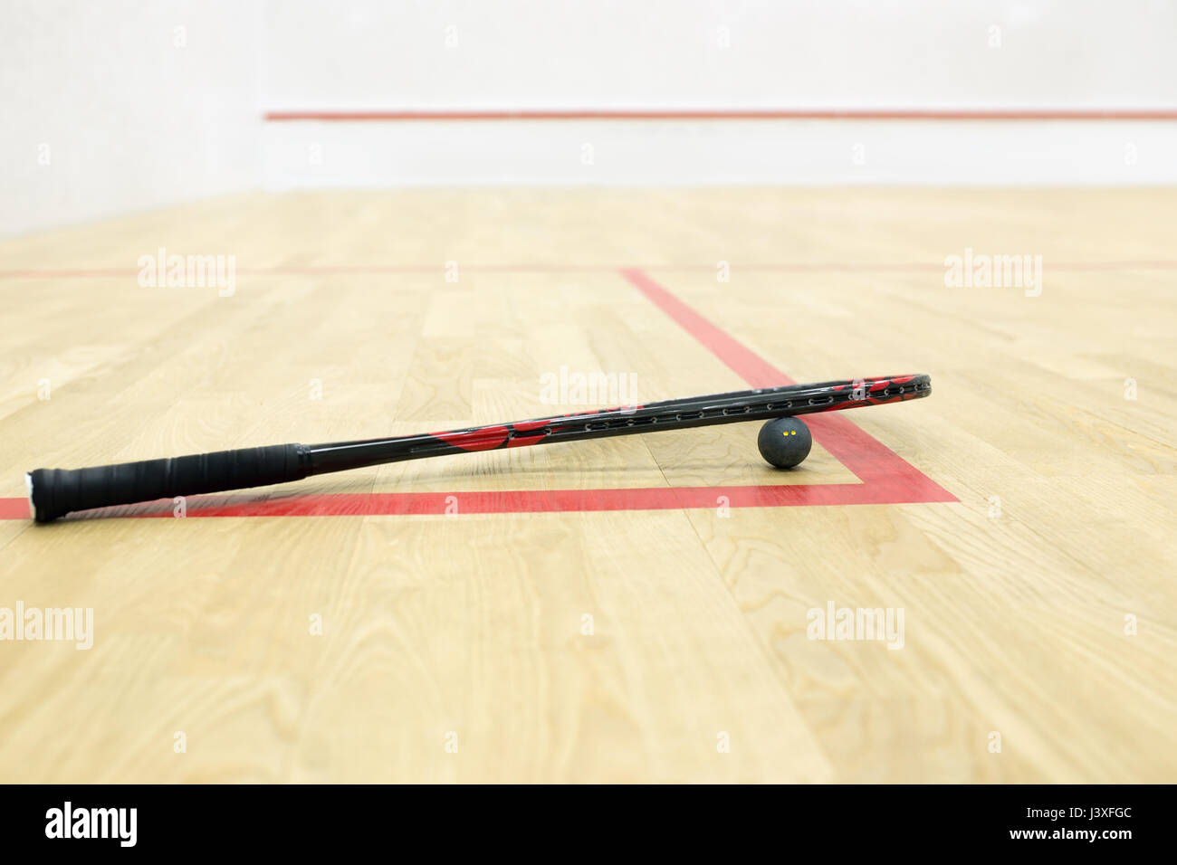 squash racket and ball on the court background. Racquetball equipment ...