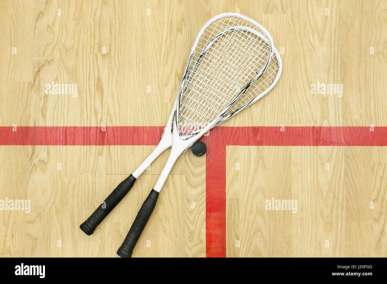 squash rackets and ball on the wooden background top view. Racquetball ...
