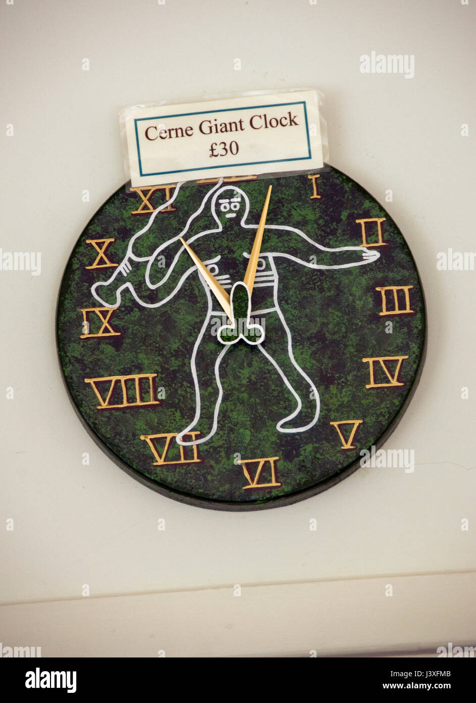 A novelty Cerne Abbas giant clock Stock Photo - Alamy