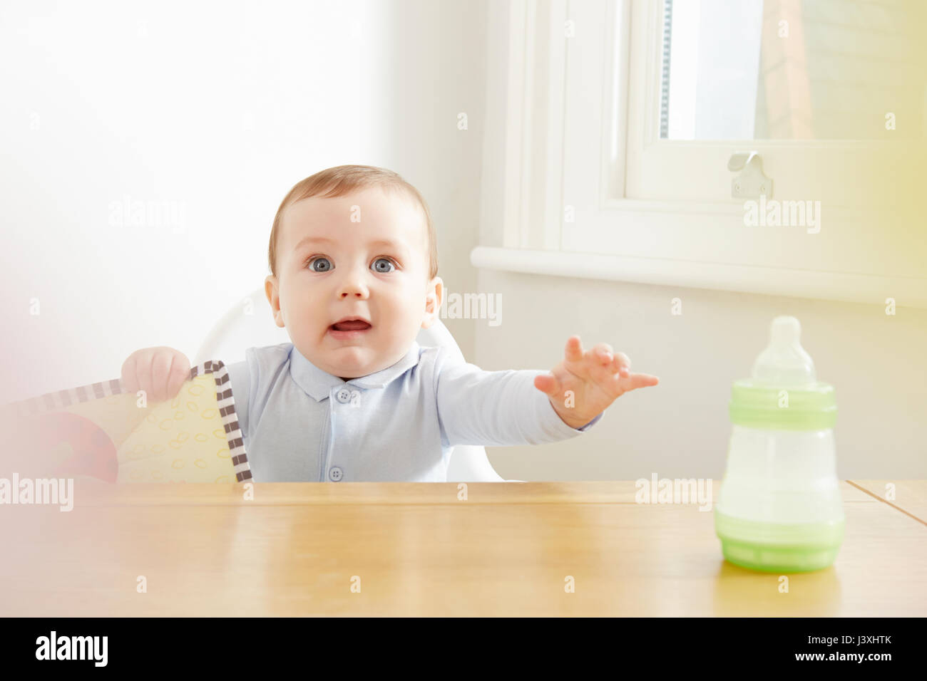 Baby reaching for milk hi-res stock photography and images - Alamy