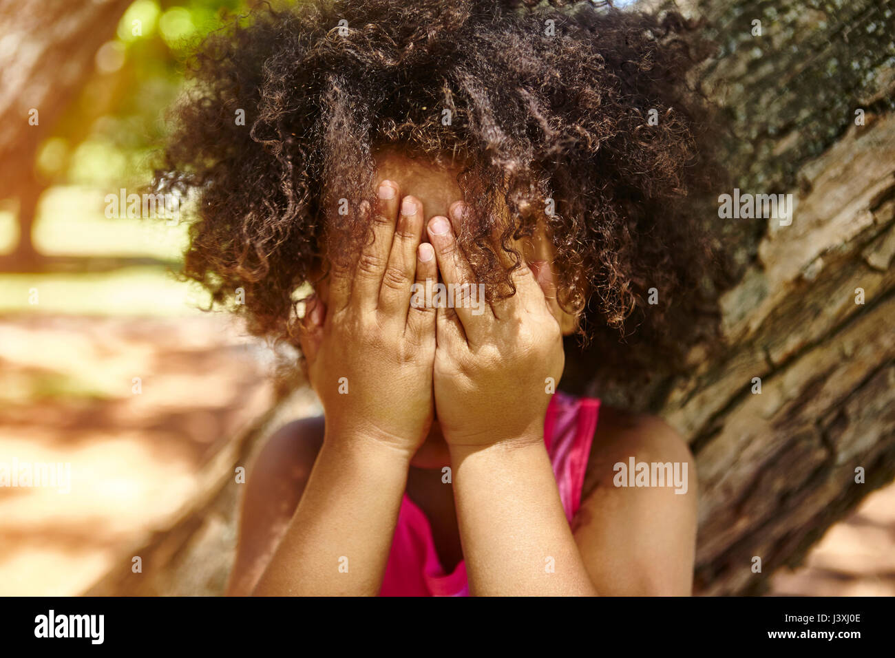 Child covering head africa hi-res stock photography and images - Alamy