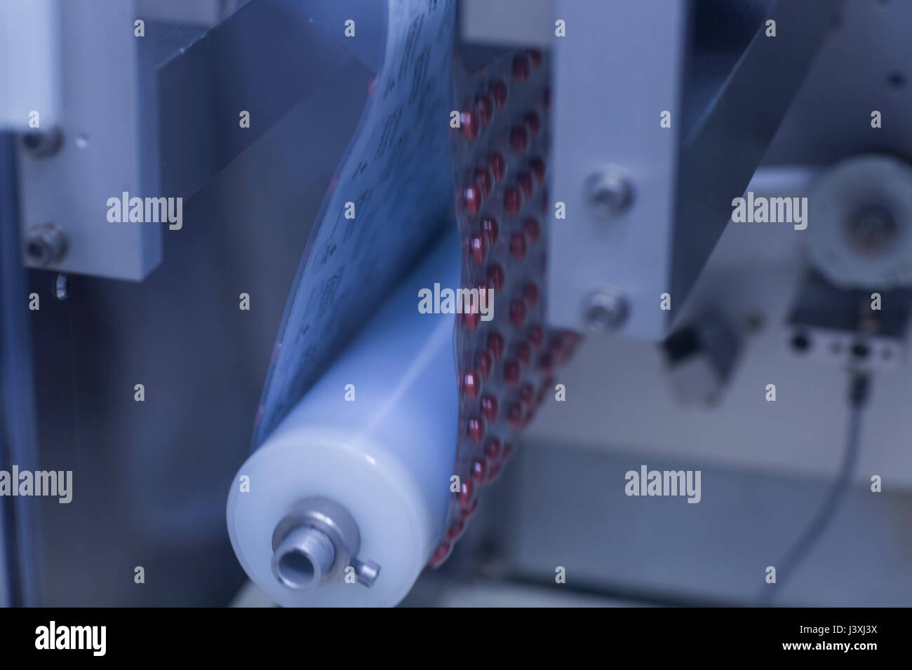 Tablet strip packing machine in pharmaceutical plant Stock Photo - Alamy