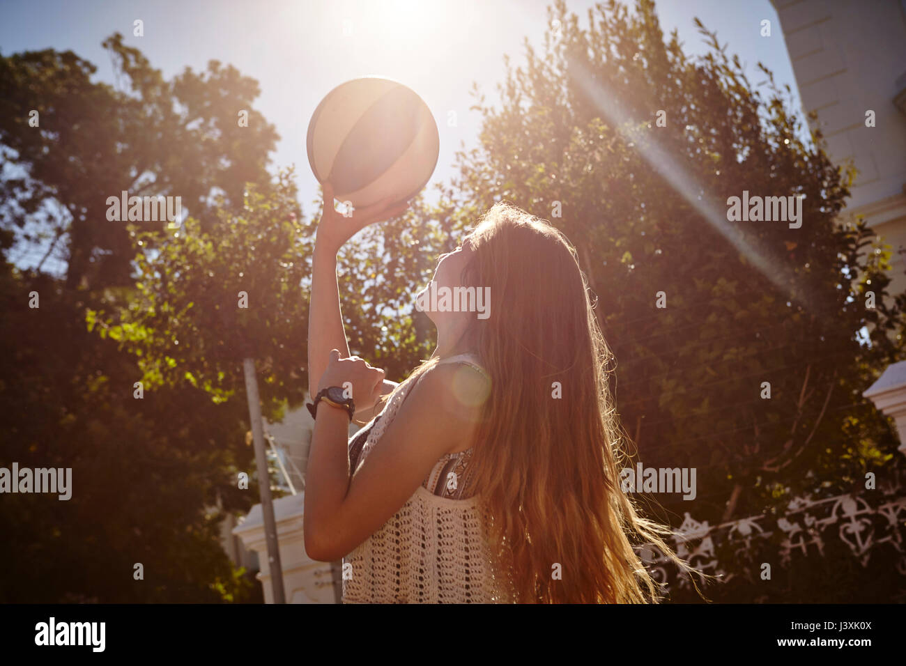 Teenage girl throwing ball in street, Cape Town, South Africa Stock ...