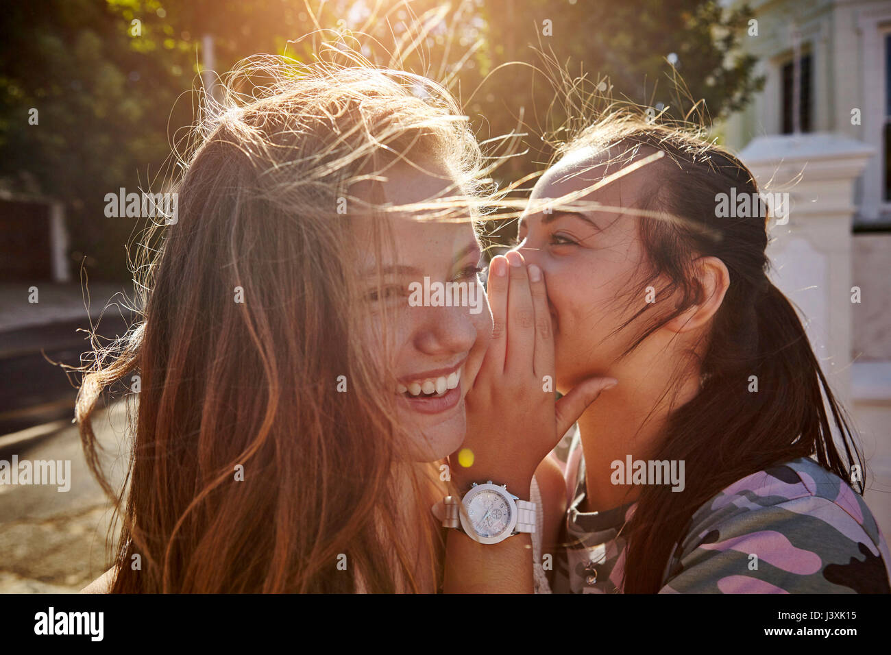Teenage girls having fun in residential street, Cape Town, South Africa ...