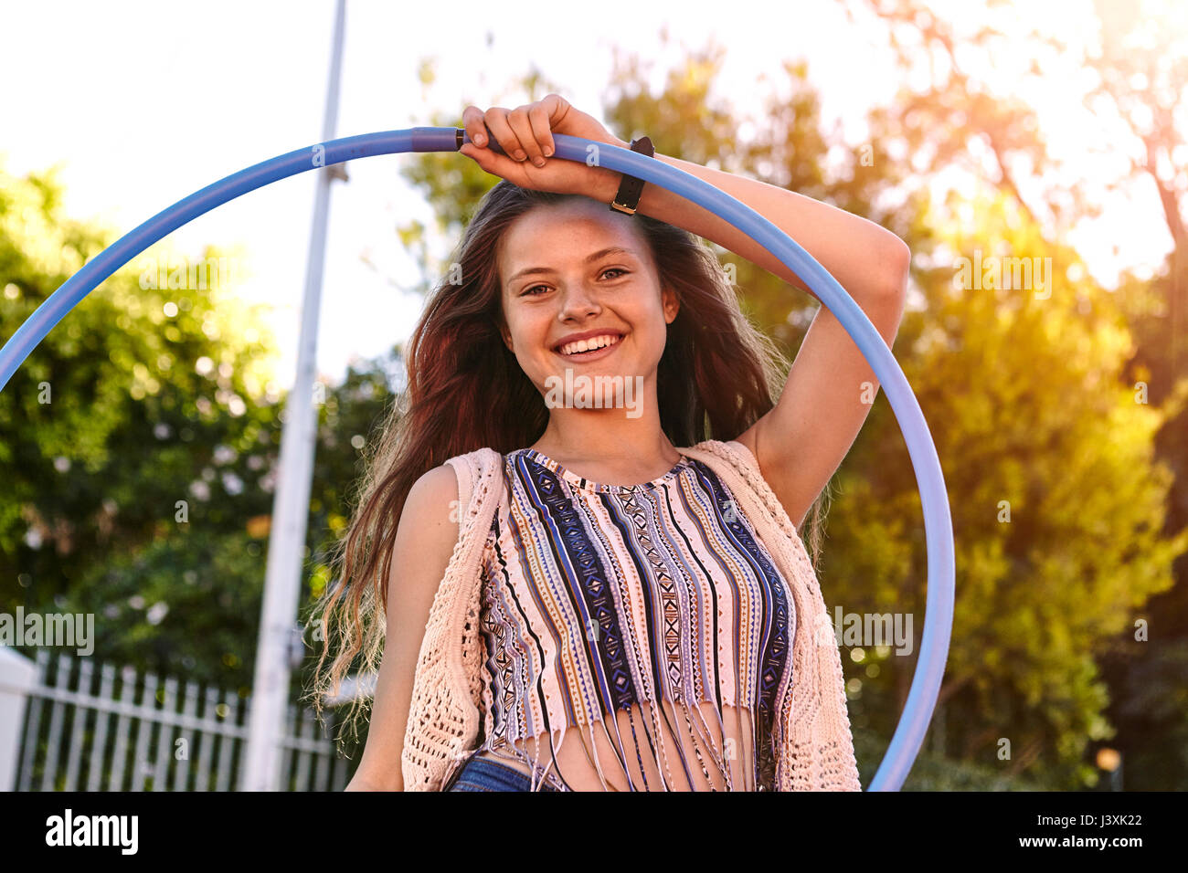 Teenage girl with hoola hoop in street, Cape Town, South Africa Stock ...
