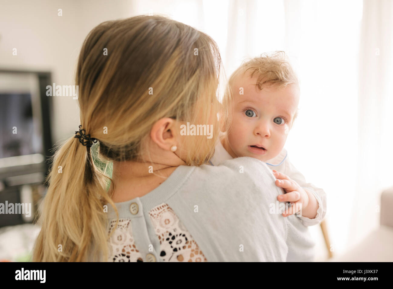 Mother and baby bonding at home Stock Photo - Alamy
