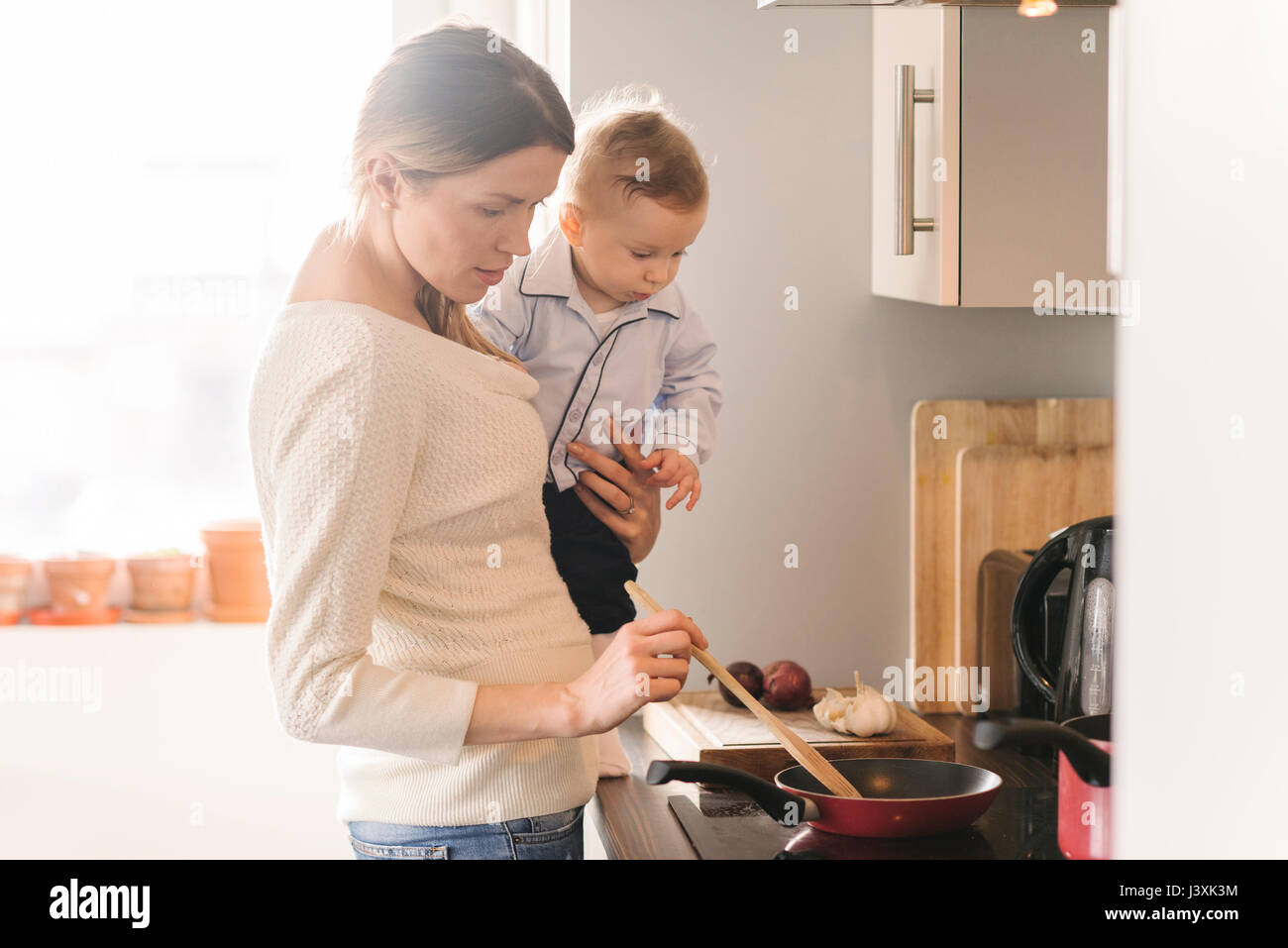 Woman multitasking arms hi-res stock photography and images - Alamy