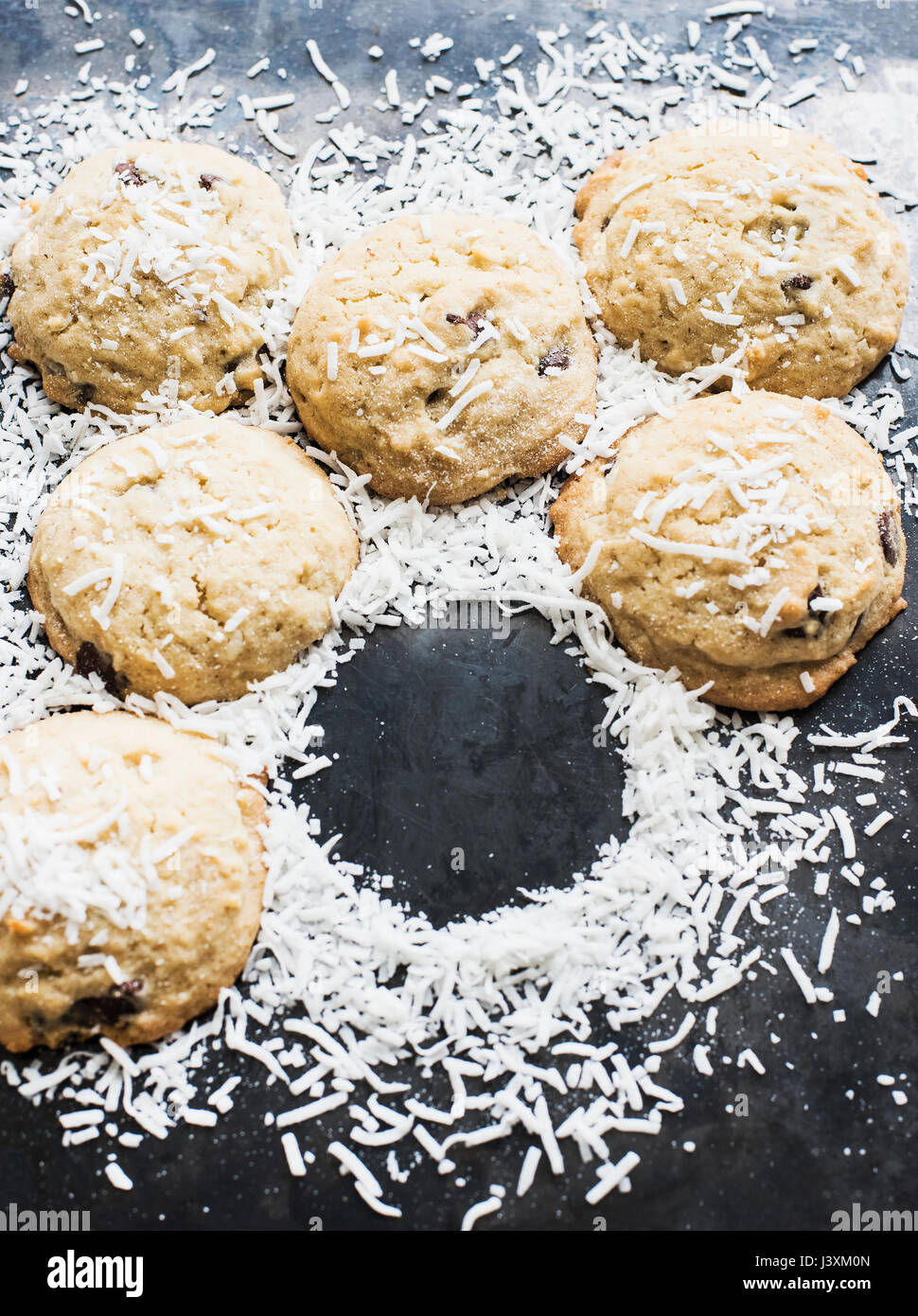 Cookies sprinkled with coconut flakes with one cookie missing Stock ...