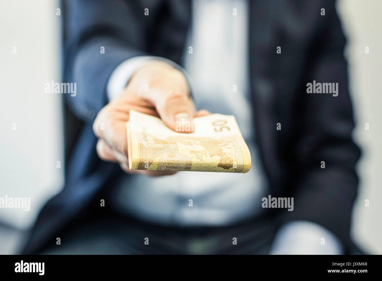 Handing money euros hi-res stock photography and images - Alamy