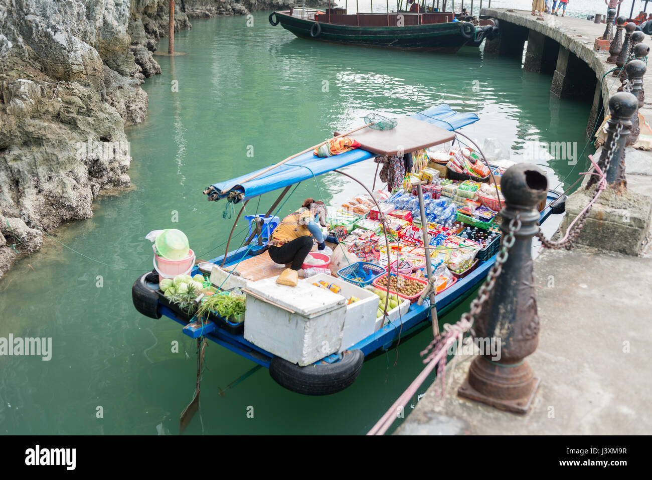 Floating vendor boat Stock Photo - Alamy