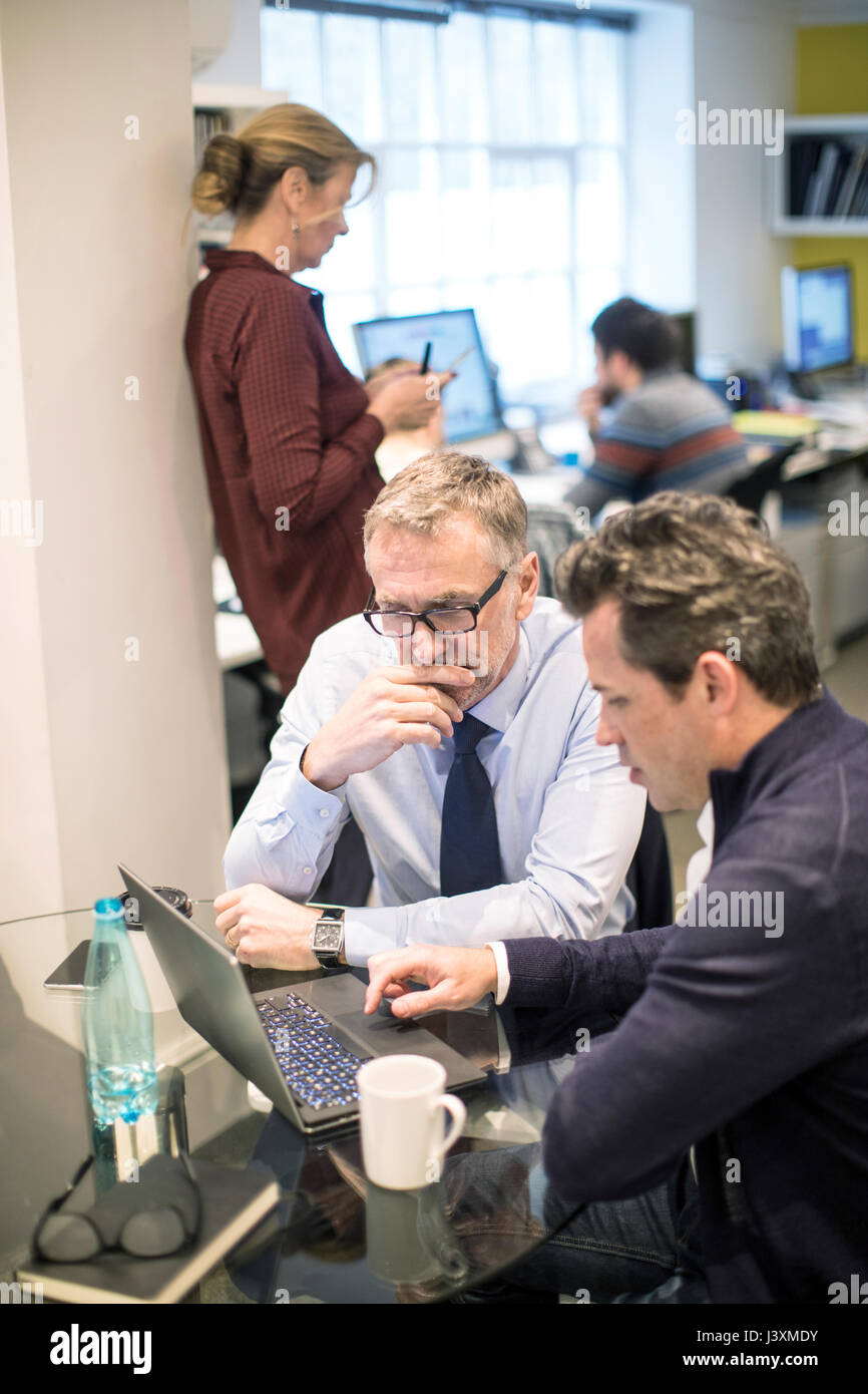 Office work solving laptop hi-res stock photography and images - Alamy