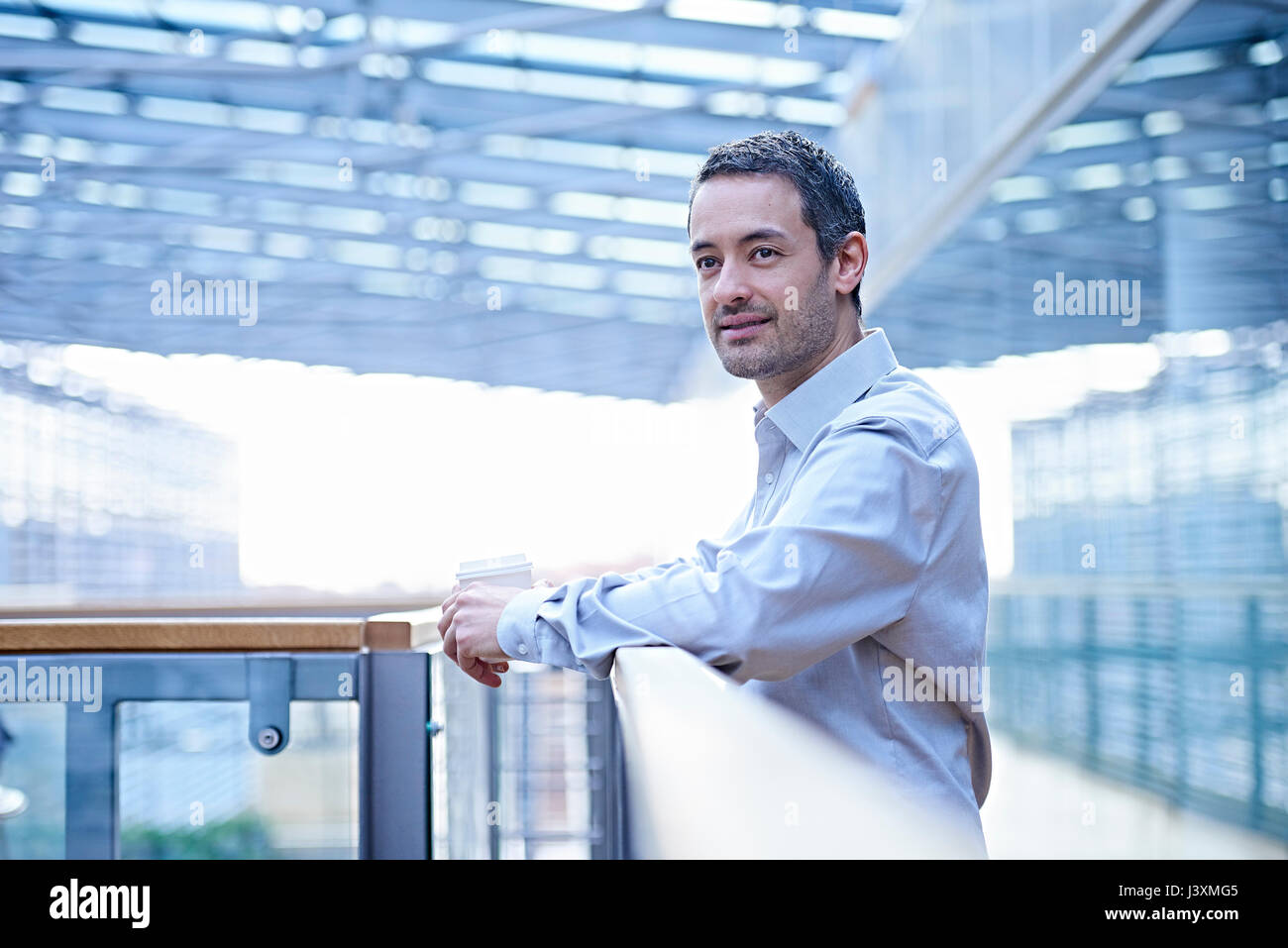 Leaning out of balcony hi-res stock photography and images - Alamy