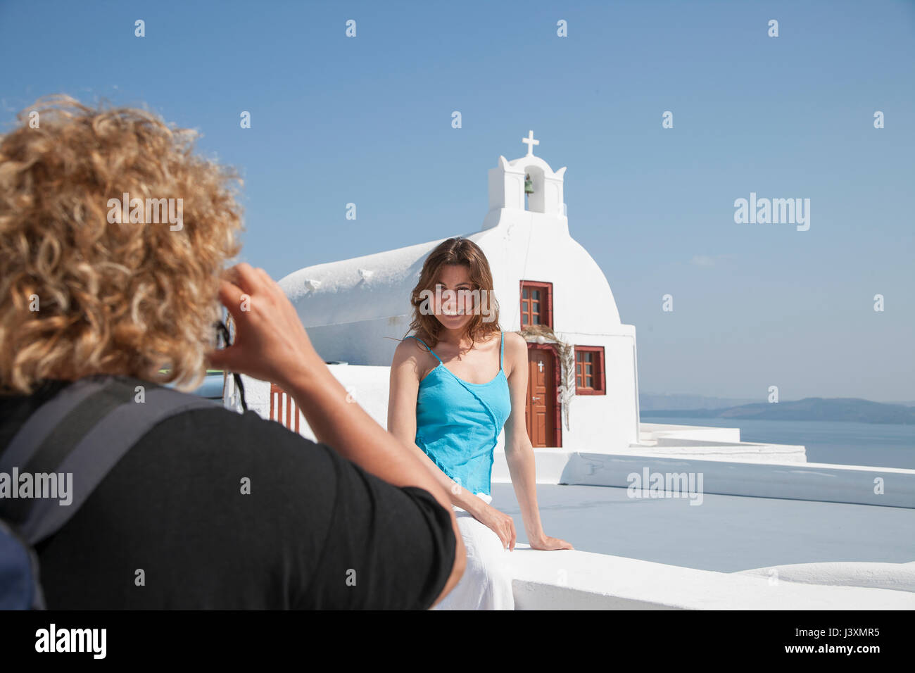 Photographer photographing model, Santorini, Cyclades, Greece Stock ...