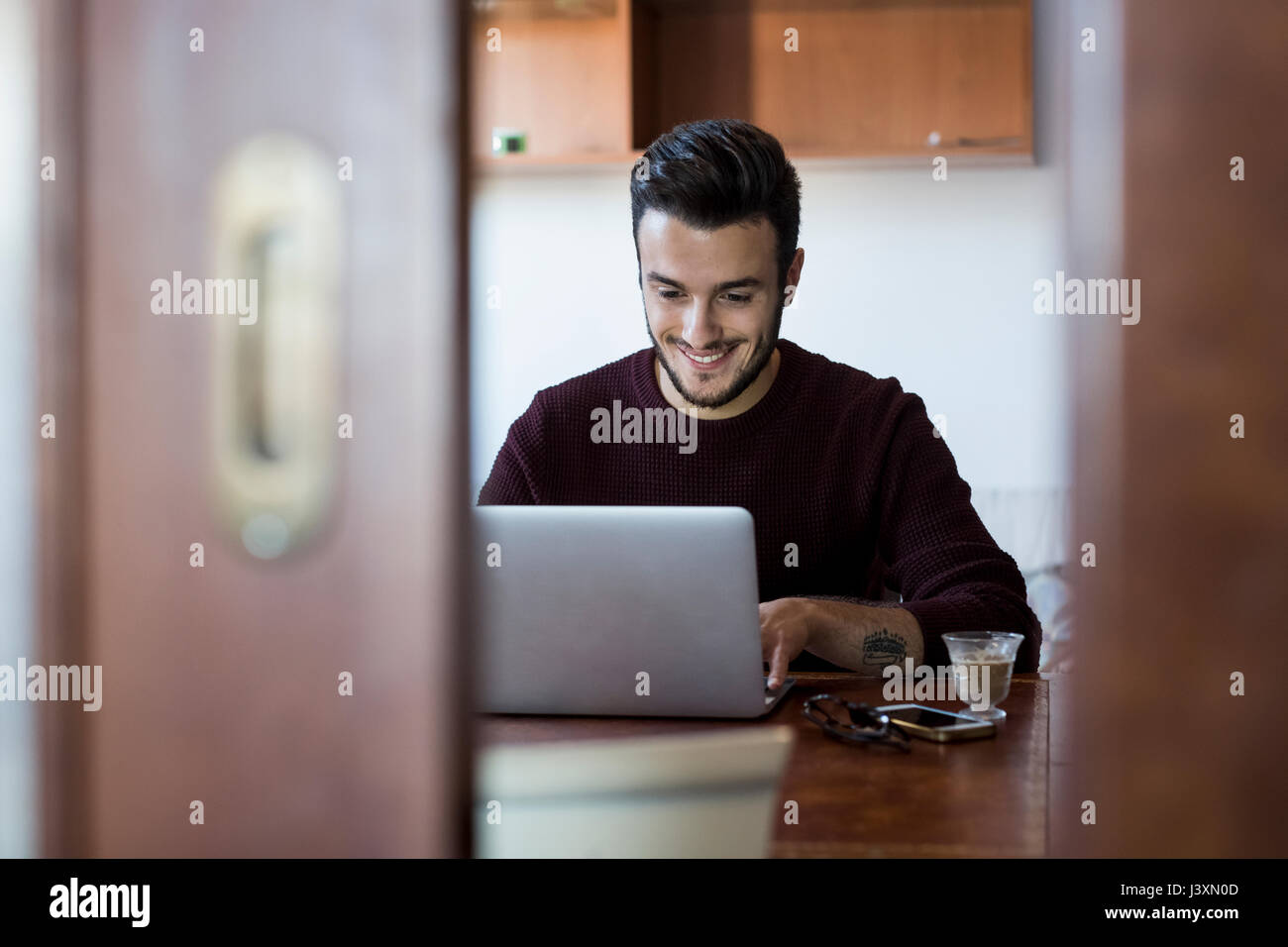 Man sitting table using hi-res stock photography and images - Alamy