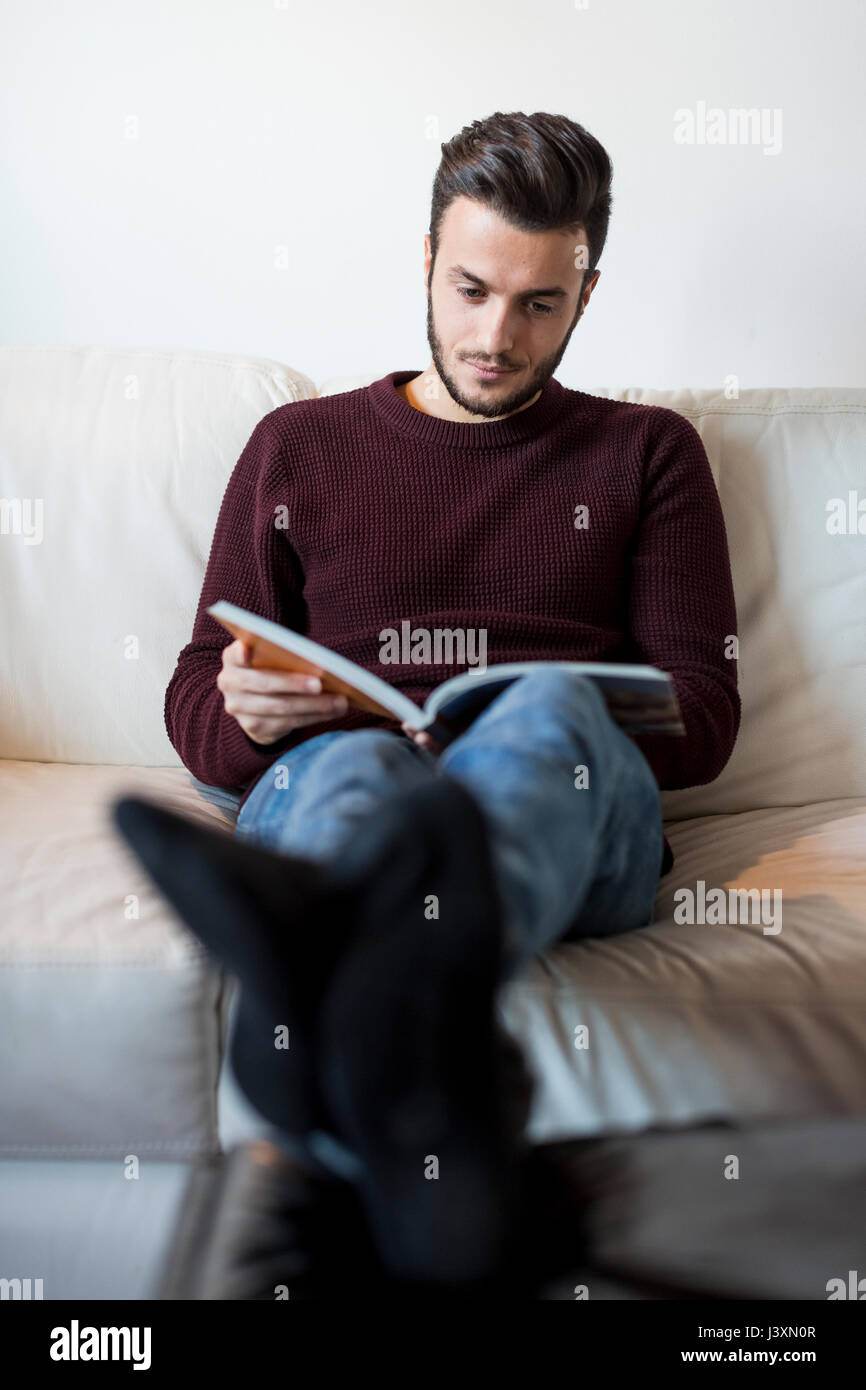 Man feet up sofa hi-res stock photography and images - Alamy