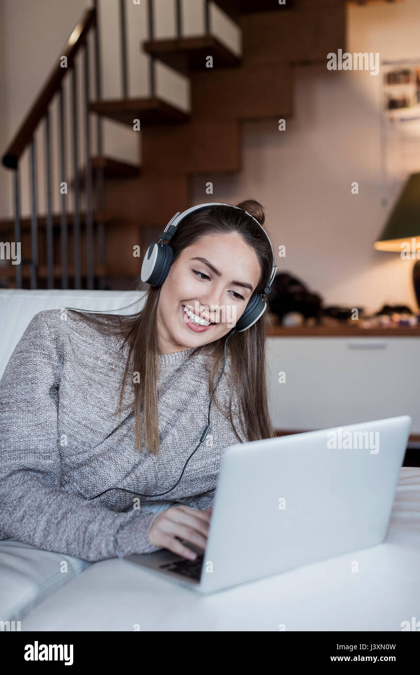 Using computer at home Stock Photo - Alamy