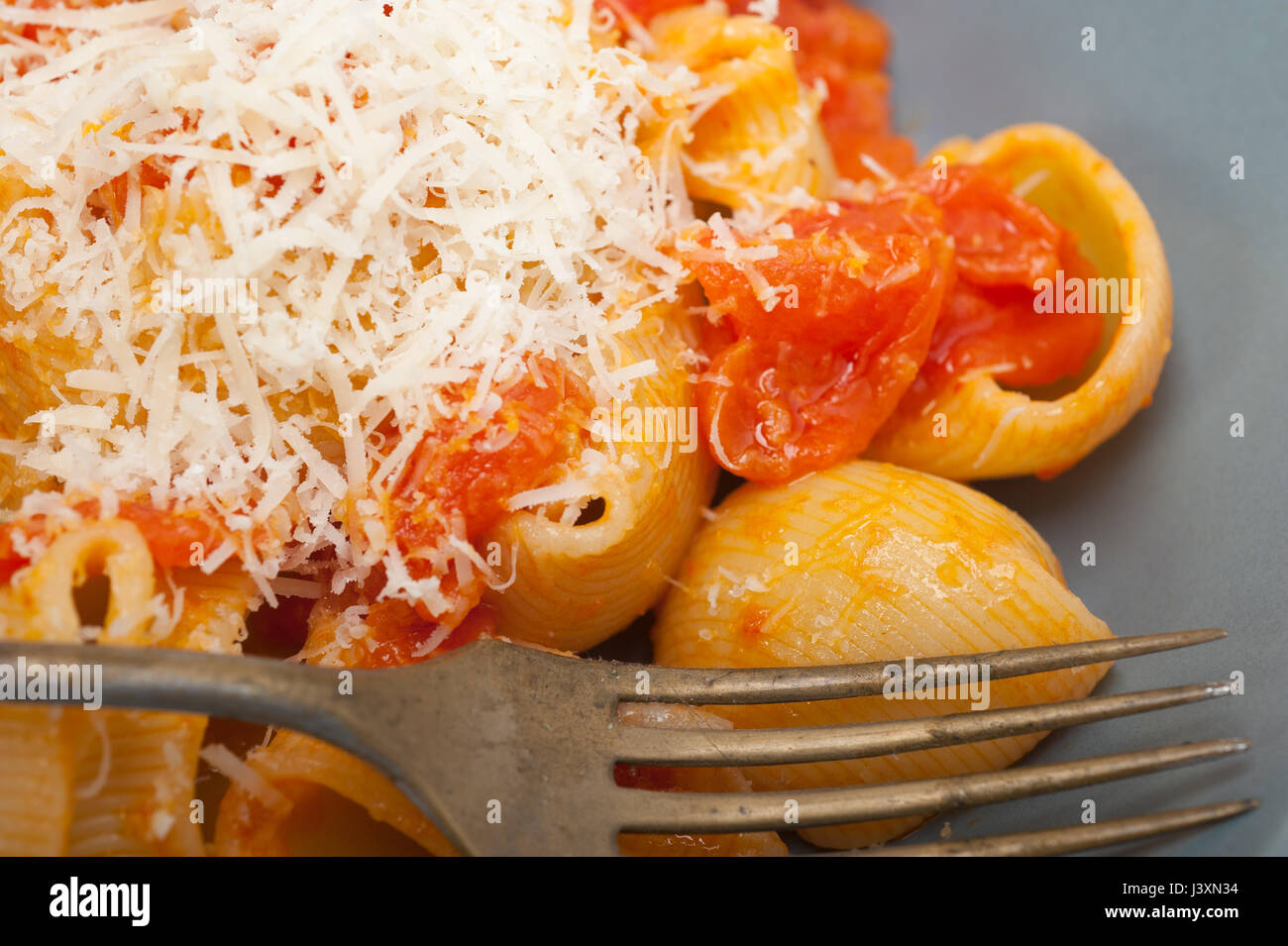 Italian snail lumaconi pasta with ripe cherry tomatoes sauce ...