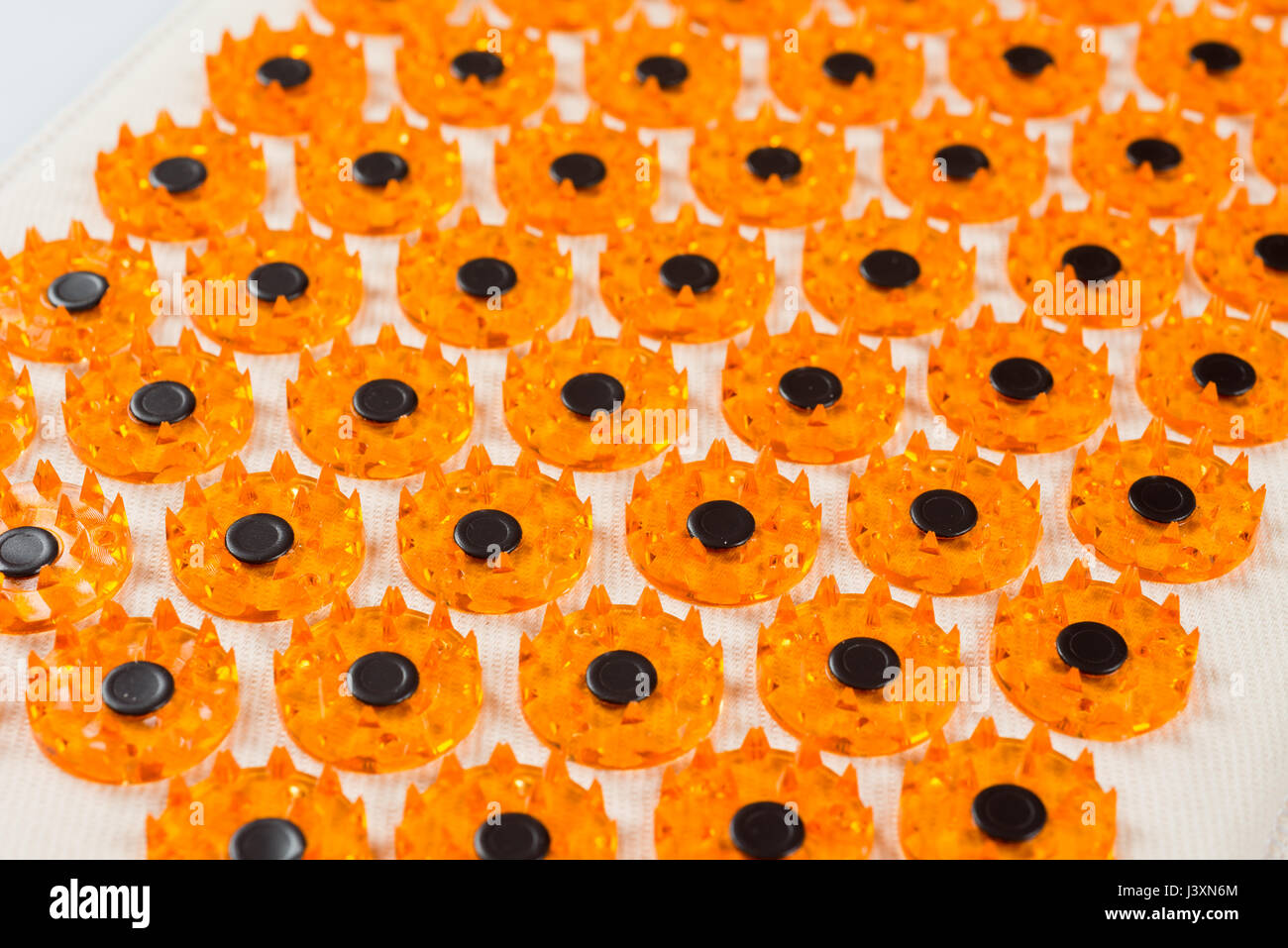 Orthopedic mat with sharp spikes Stock Photo - Alamy