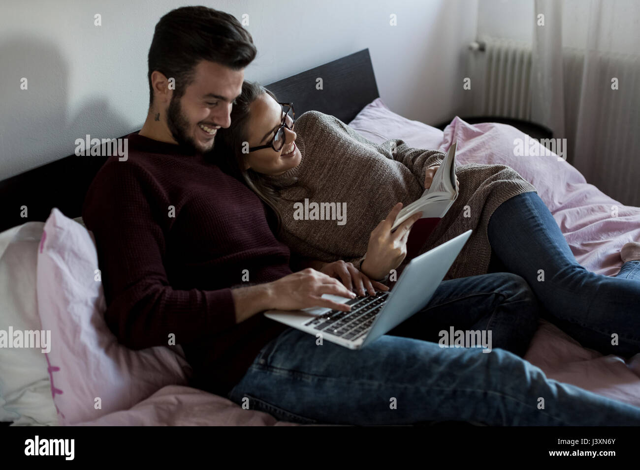 Using computer at home Stock Photo - Alamy