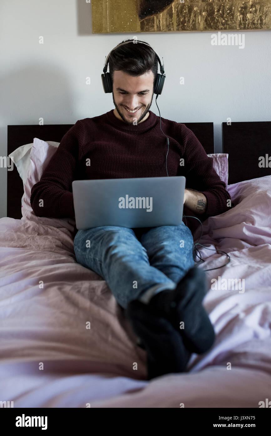 Using computer at home Stock Photo - Alamy