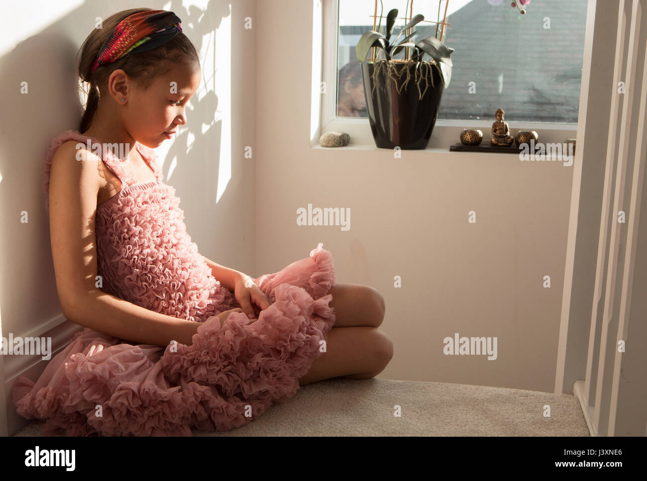 Sad girl sitting on stairs hi-res stock photography and images - Alamy