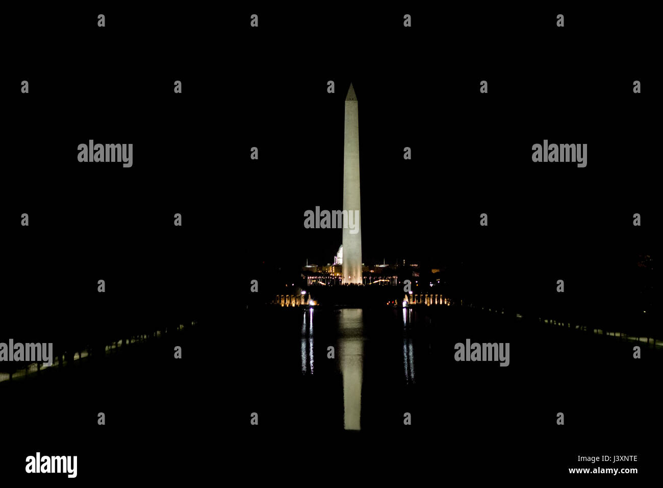 Washington Monument at night with mirror reflection on water ...