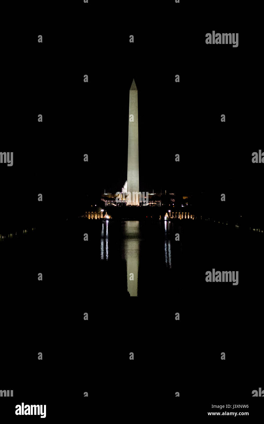 Washington Monument at night with mirror reflection on water ...