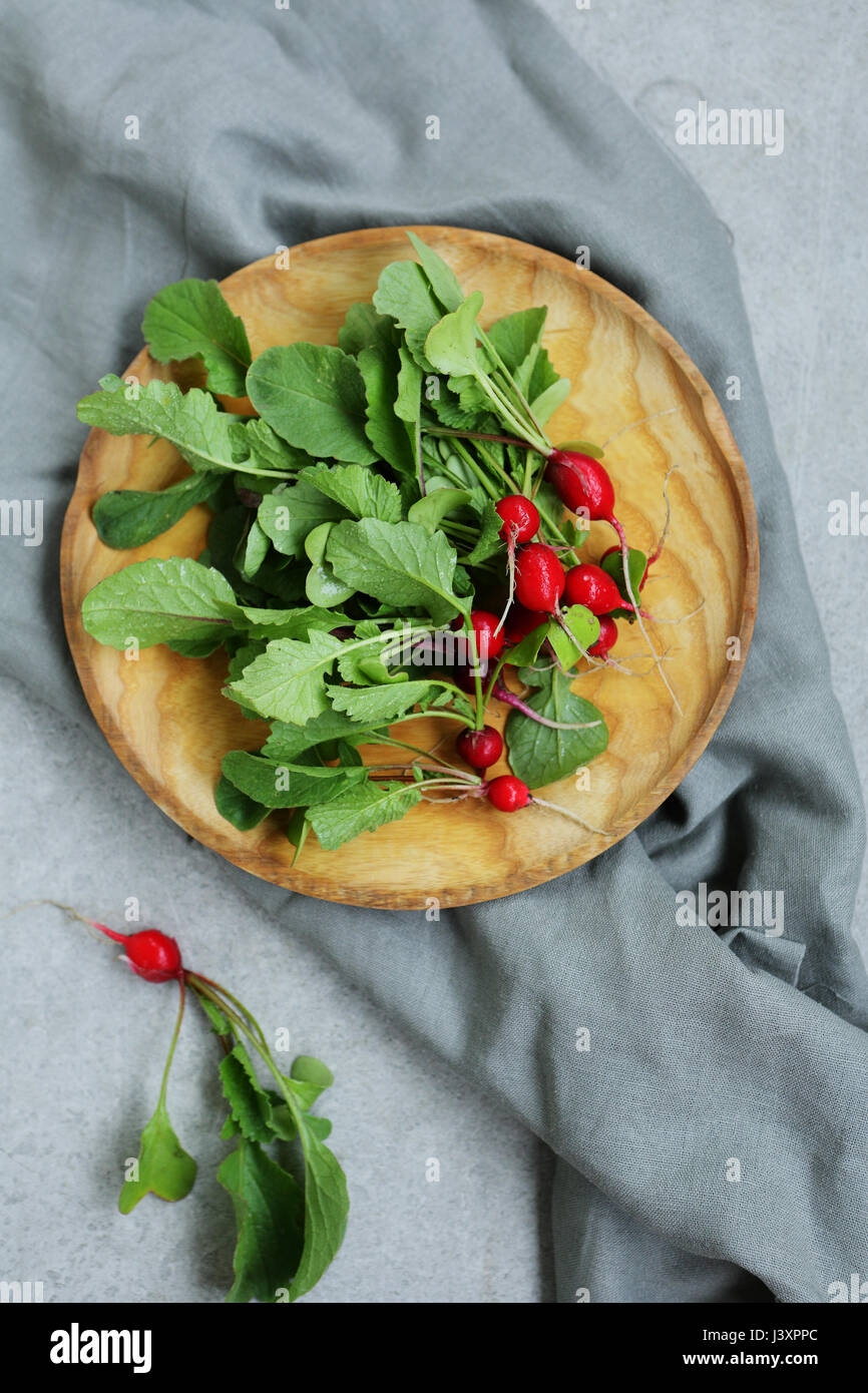 Natural radishes on wood plate, organic food Stock Photo - Alamy
